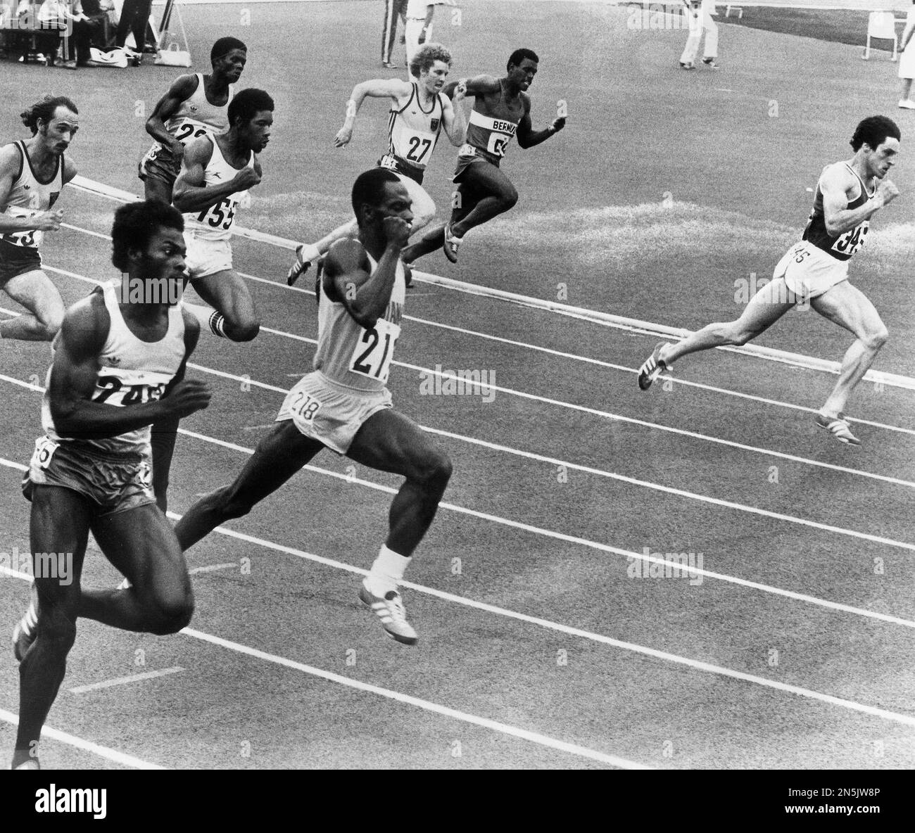 Alan Wells of Scotland, right, heads for the finish line and the Gold ...