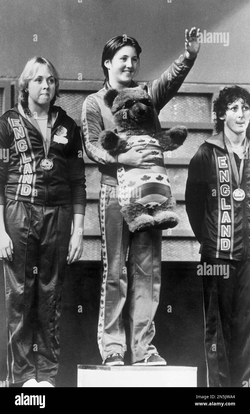 Lisa Borsholt of Canada, center, waves to the crowd after she had been ...
