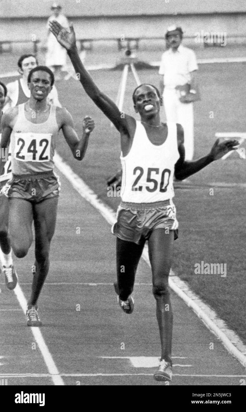 Mike Boit of Kenya crosses the finish line to take the Gold medal in ...