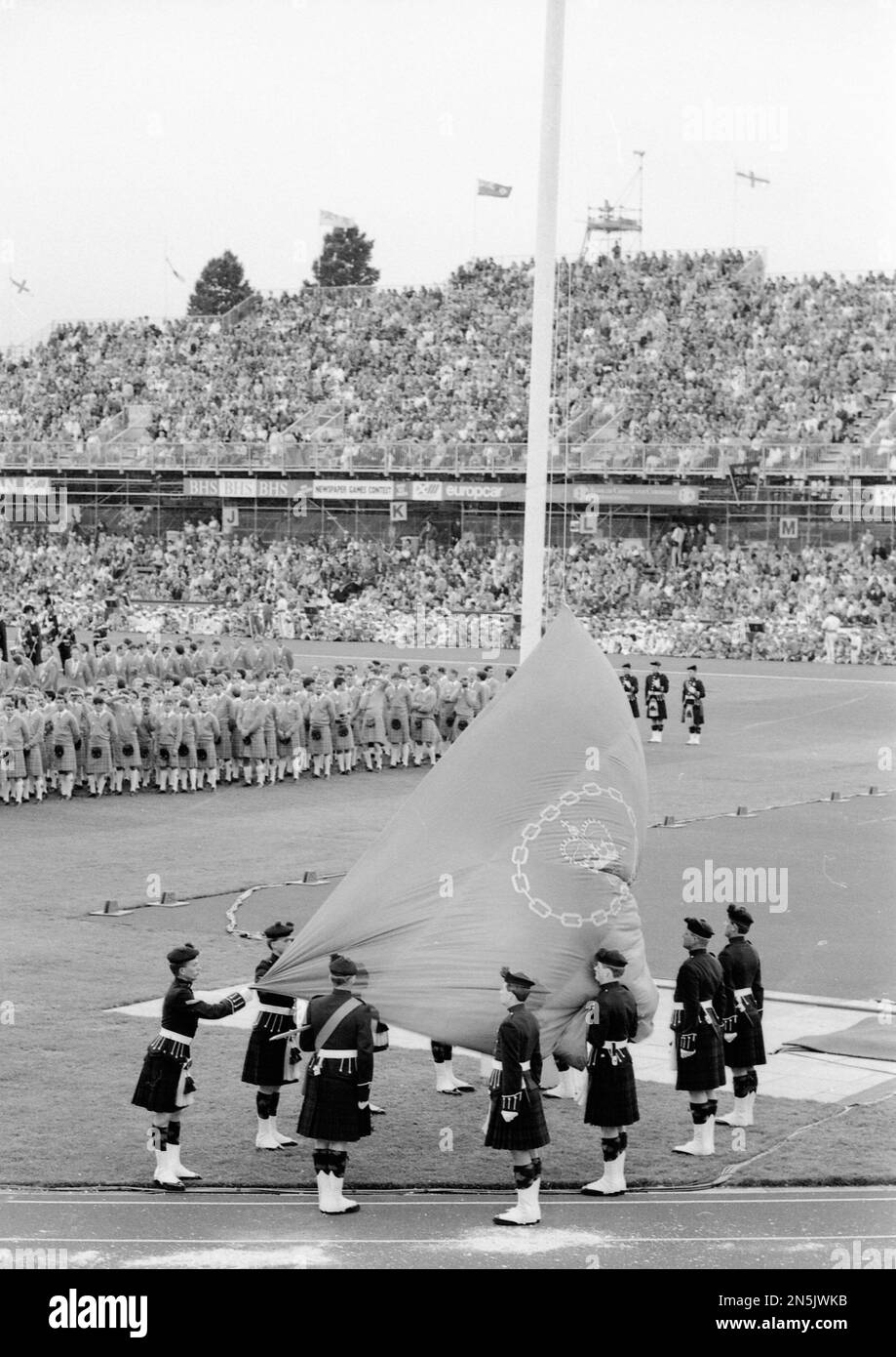 The flag of the Commonwealth Games Federation is raised at opening ...