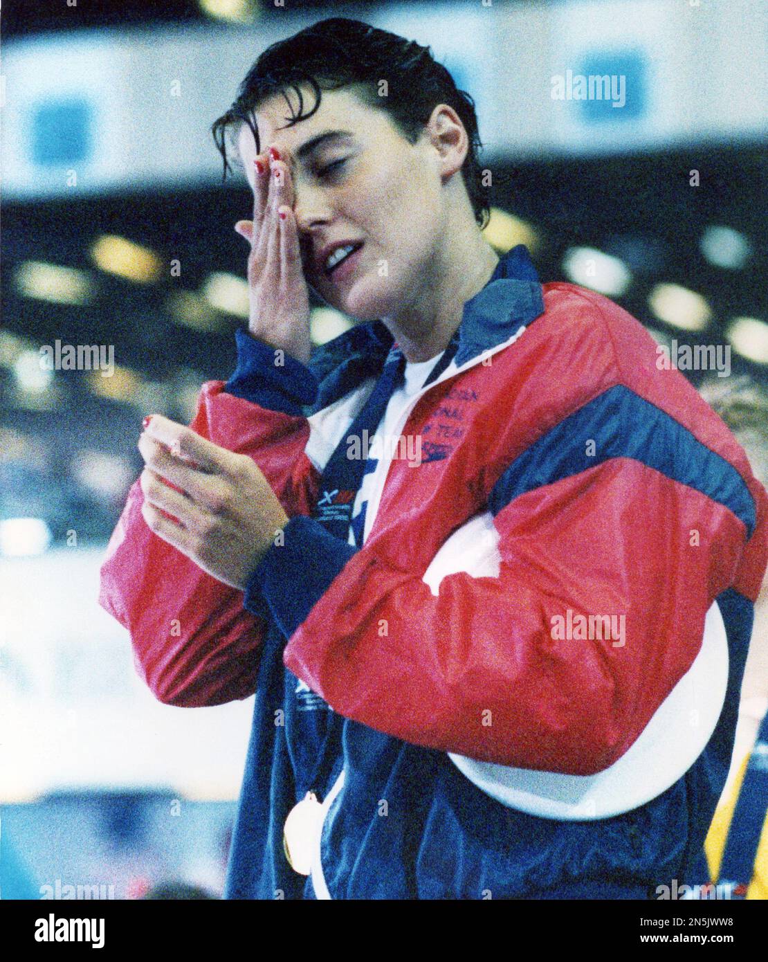 Jane Kerr of Canada wipes tears from her eyes as she stands on the ...