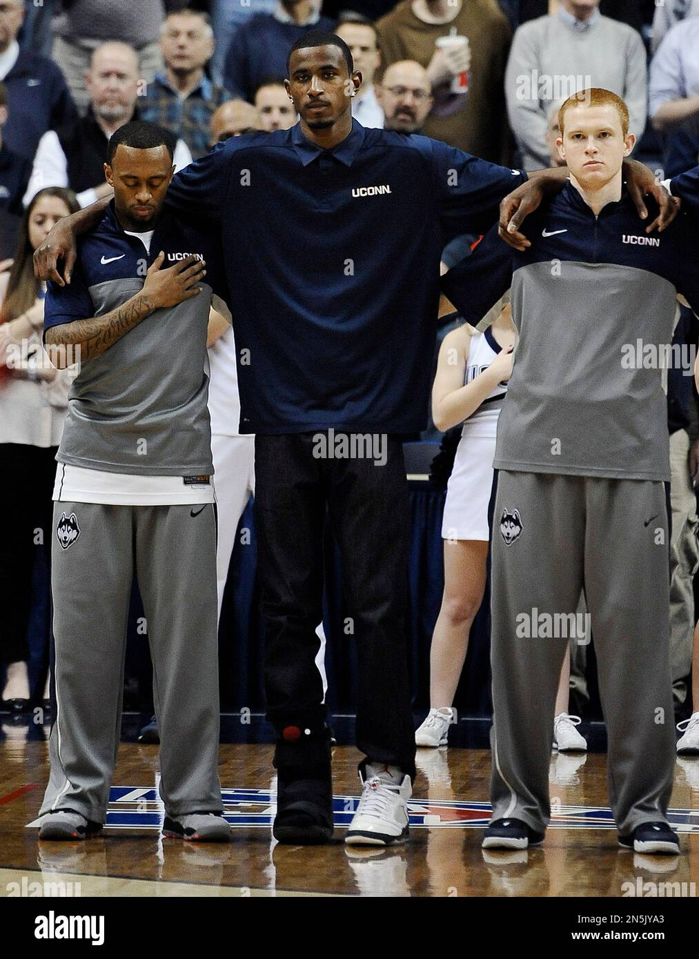 Connecticut's DeAndre Daniels, center, stands with teammates Ryan ...