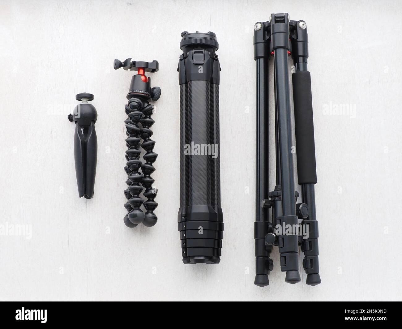 Set of four photographs tripods different size Stock Photo - Alamy