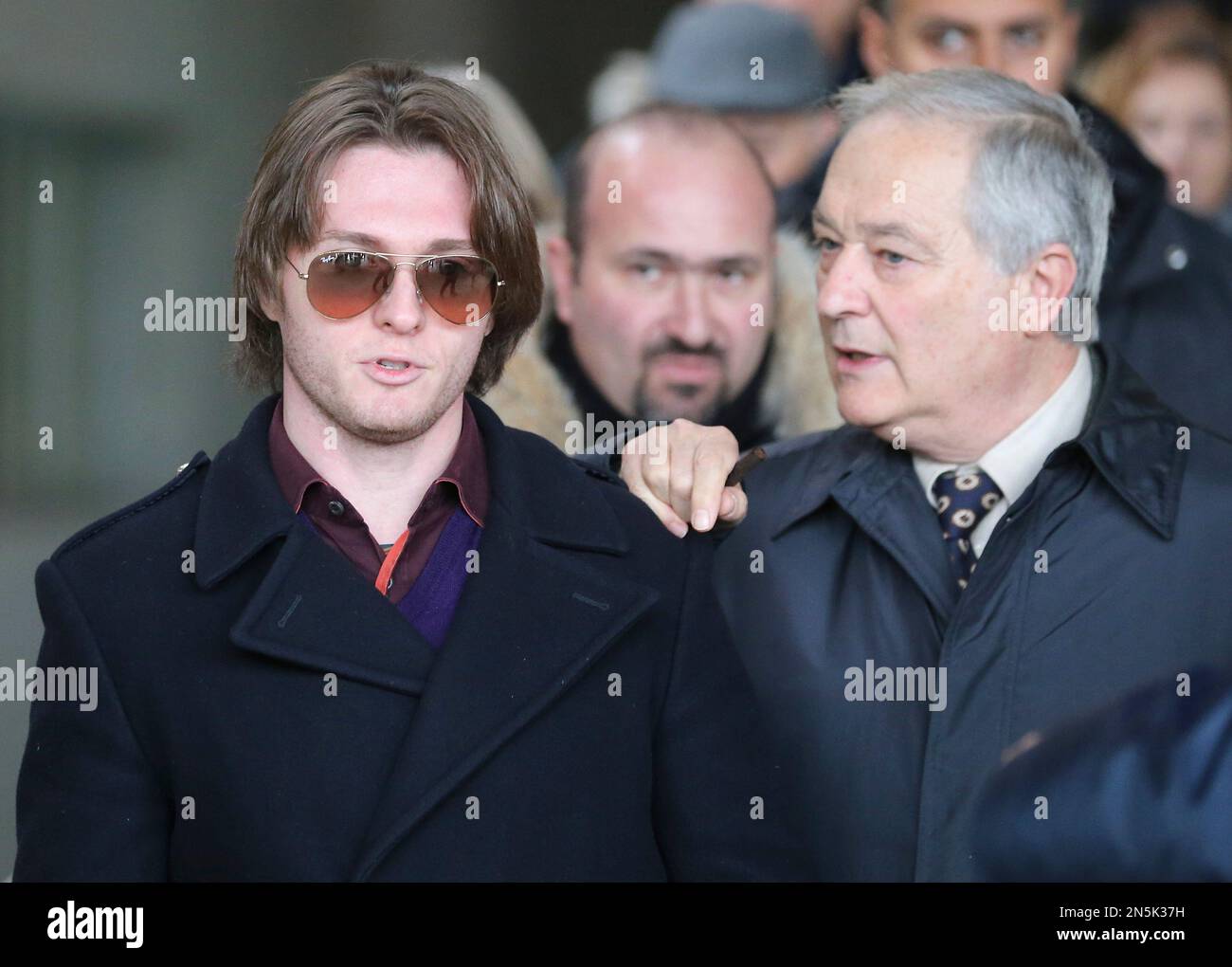 Raffaele Sollecito, left, and his father Francesco leave after ...