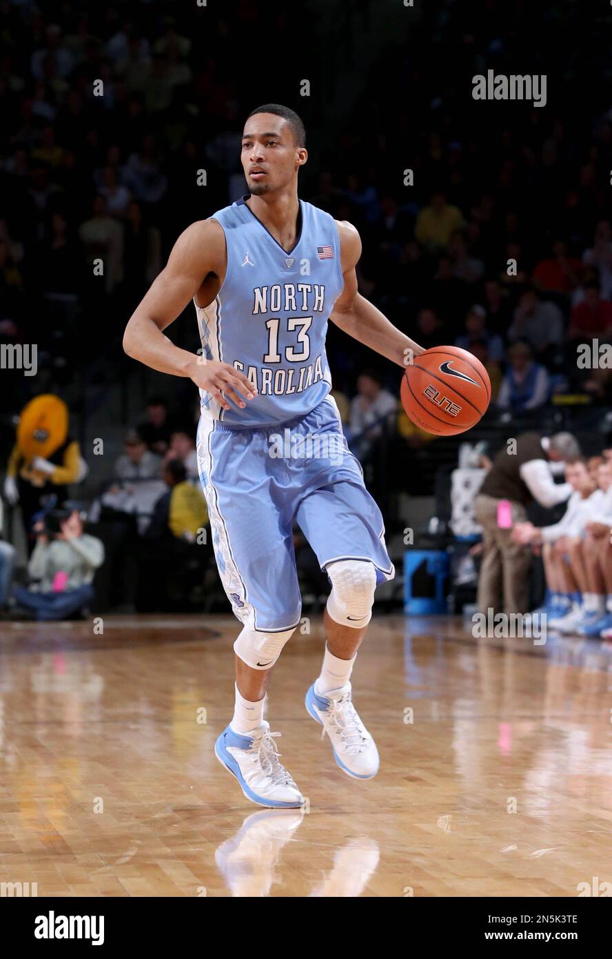 North Carolina forward J.P. Tokoto (13) pushes the ball up the court in ...