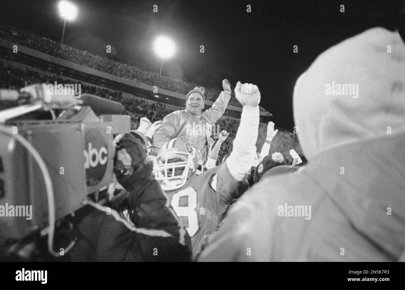 University of Florida head football coach Charlie Pell gets a ride on ...