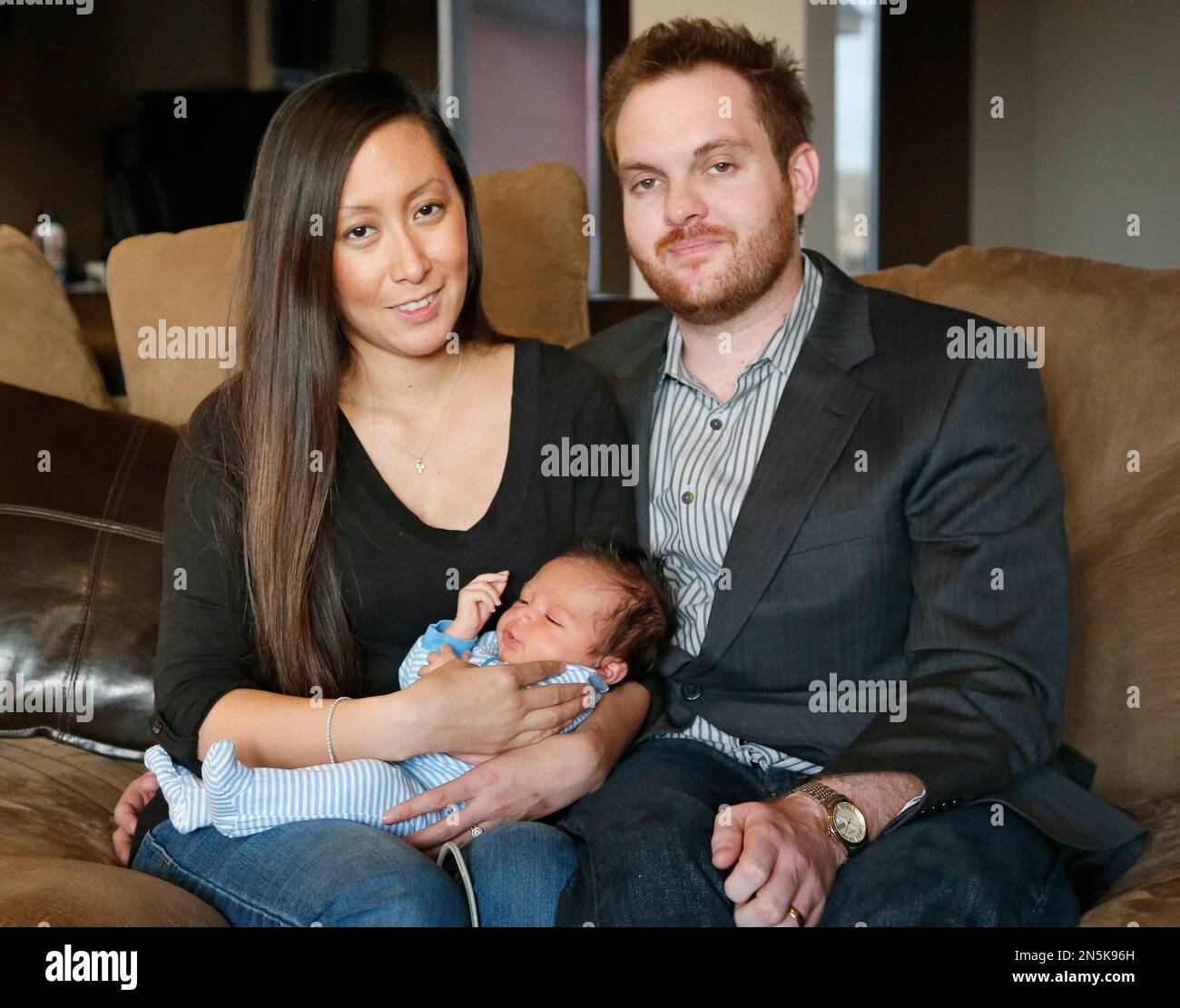 Jennifer Rogers, left, and her husband Nyle Rogers, right, smile as ...
