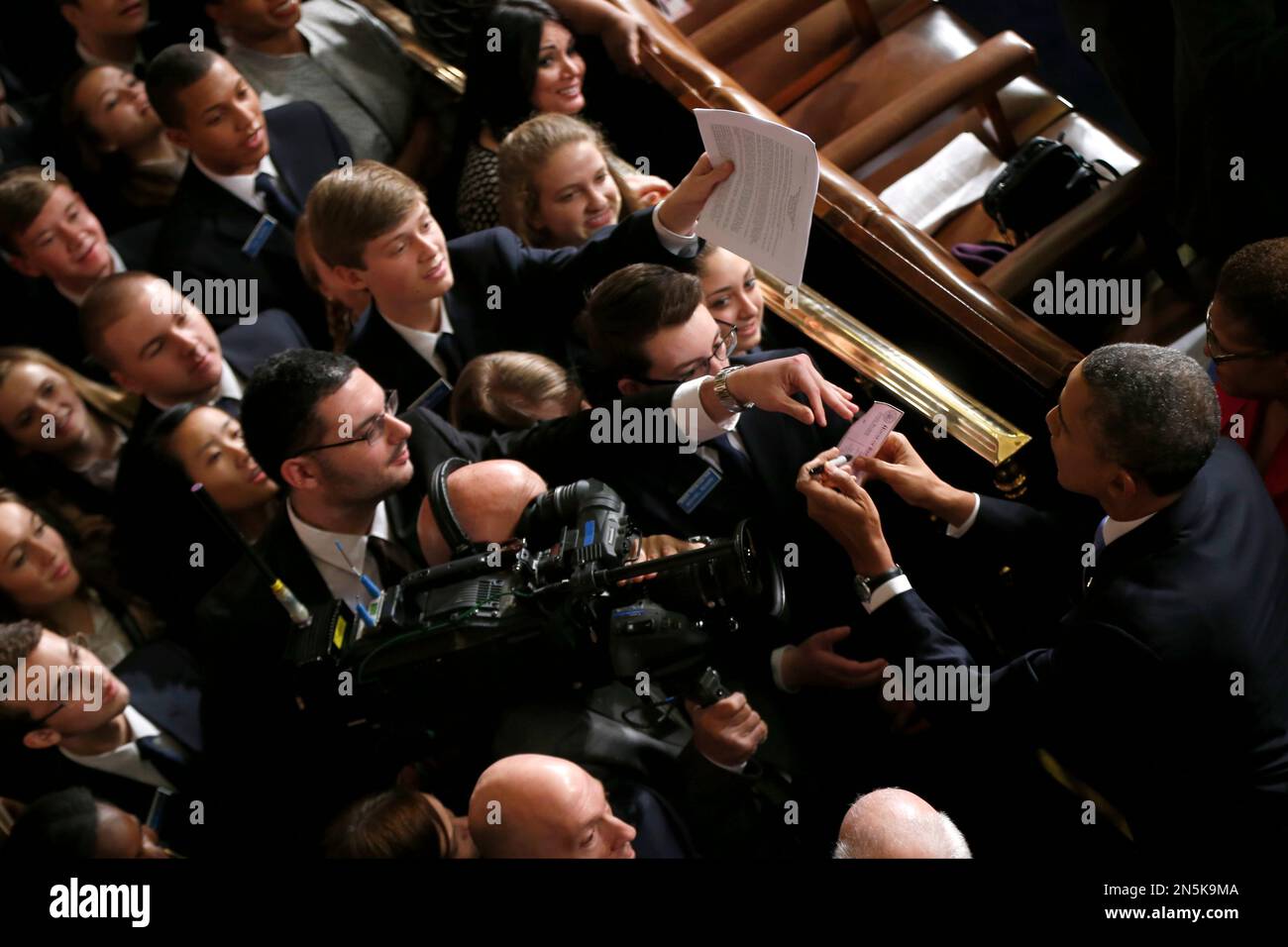 President Barack Obama signs an autograph after giving his State of the ...