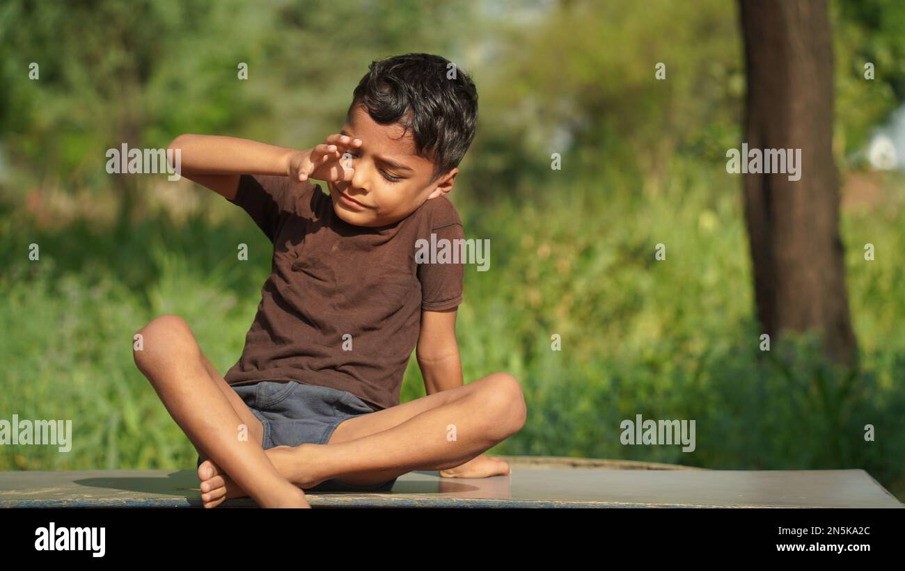 Boy doing yoga pose in hi-res stock photography and images - Alamy
