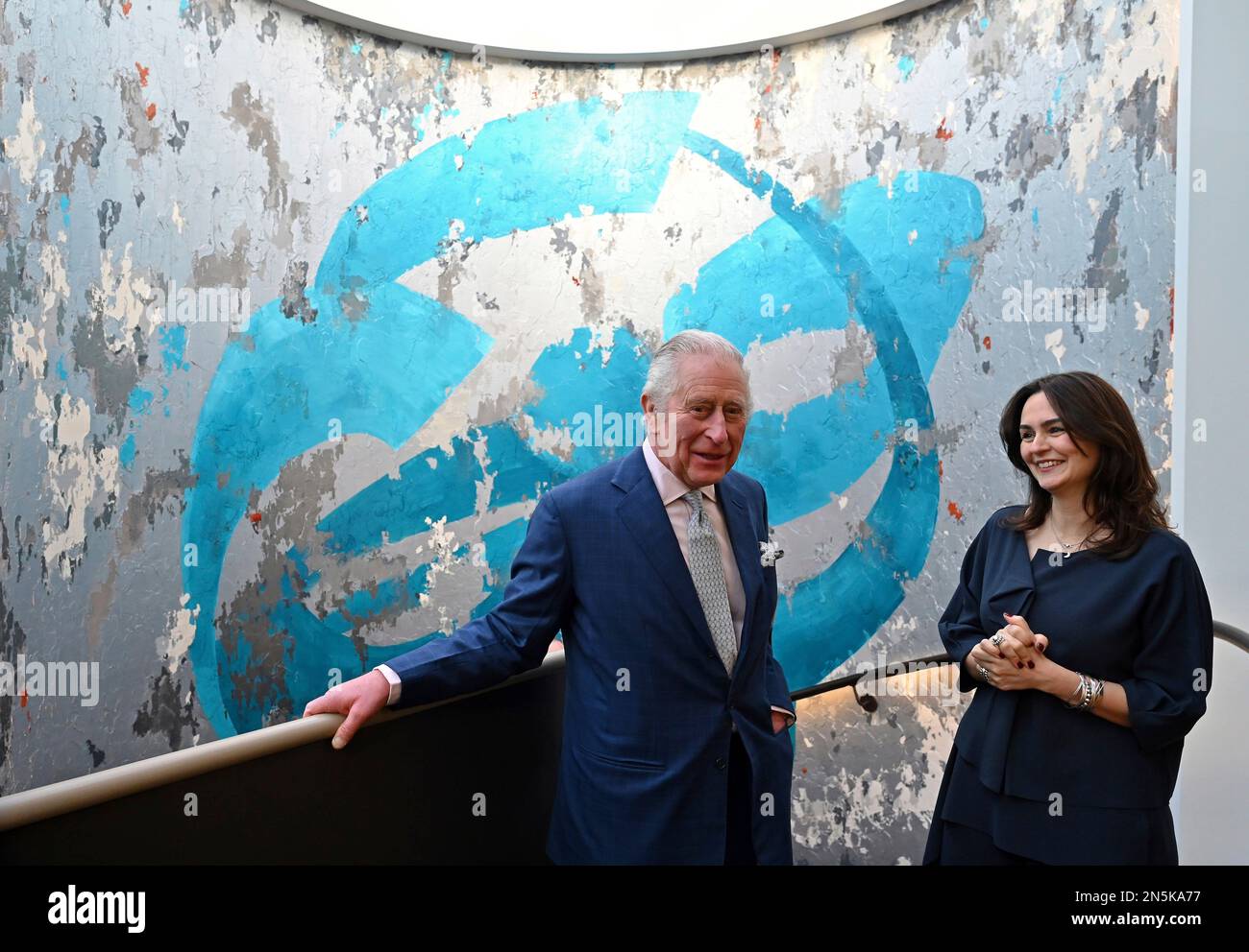 Britain's King Charles III speaks with Iranian artist Shahrzad Ghaffari as they stand near her ...