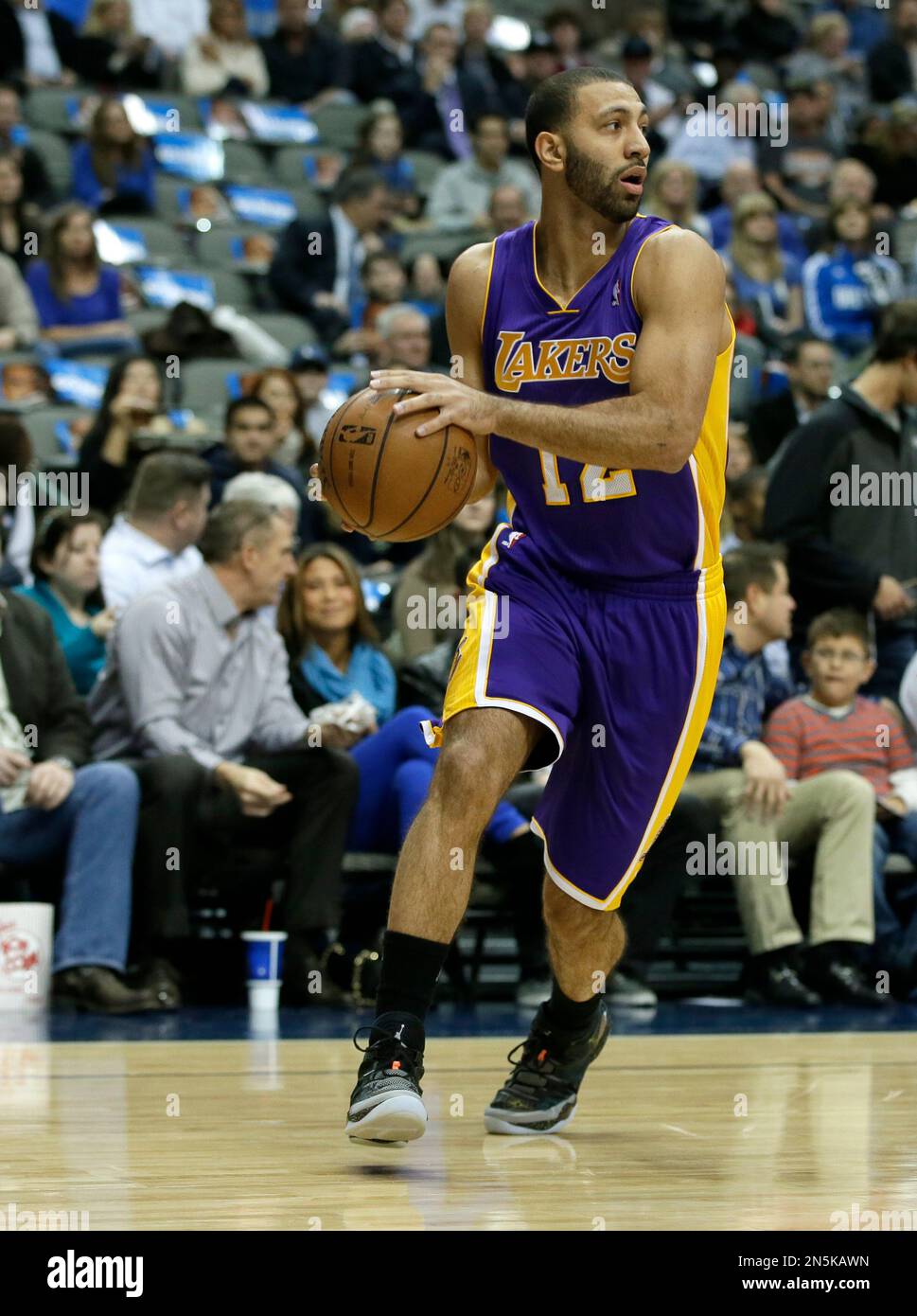 Los Angeles Lakers' Kendall Marshall (12) prepares to pass the ball during an NBA basketball ...
