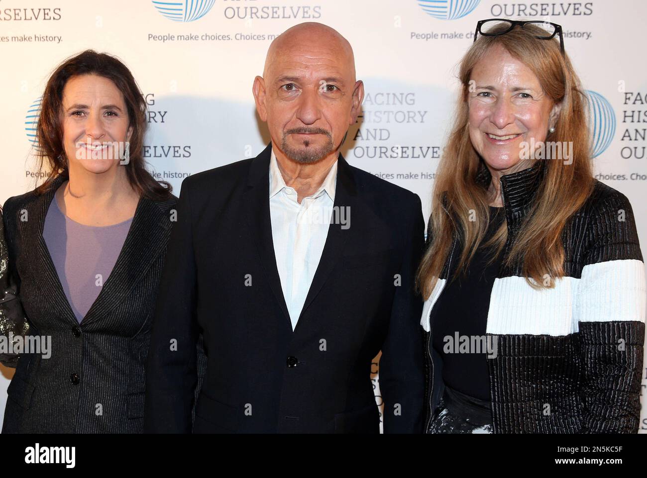 Sir Ben Kingsley, center, Margot Stern Strom, and Gigi Pritzker pose ...