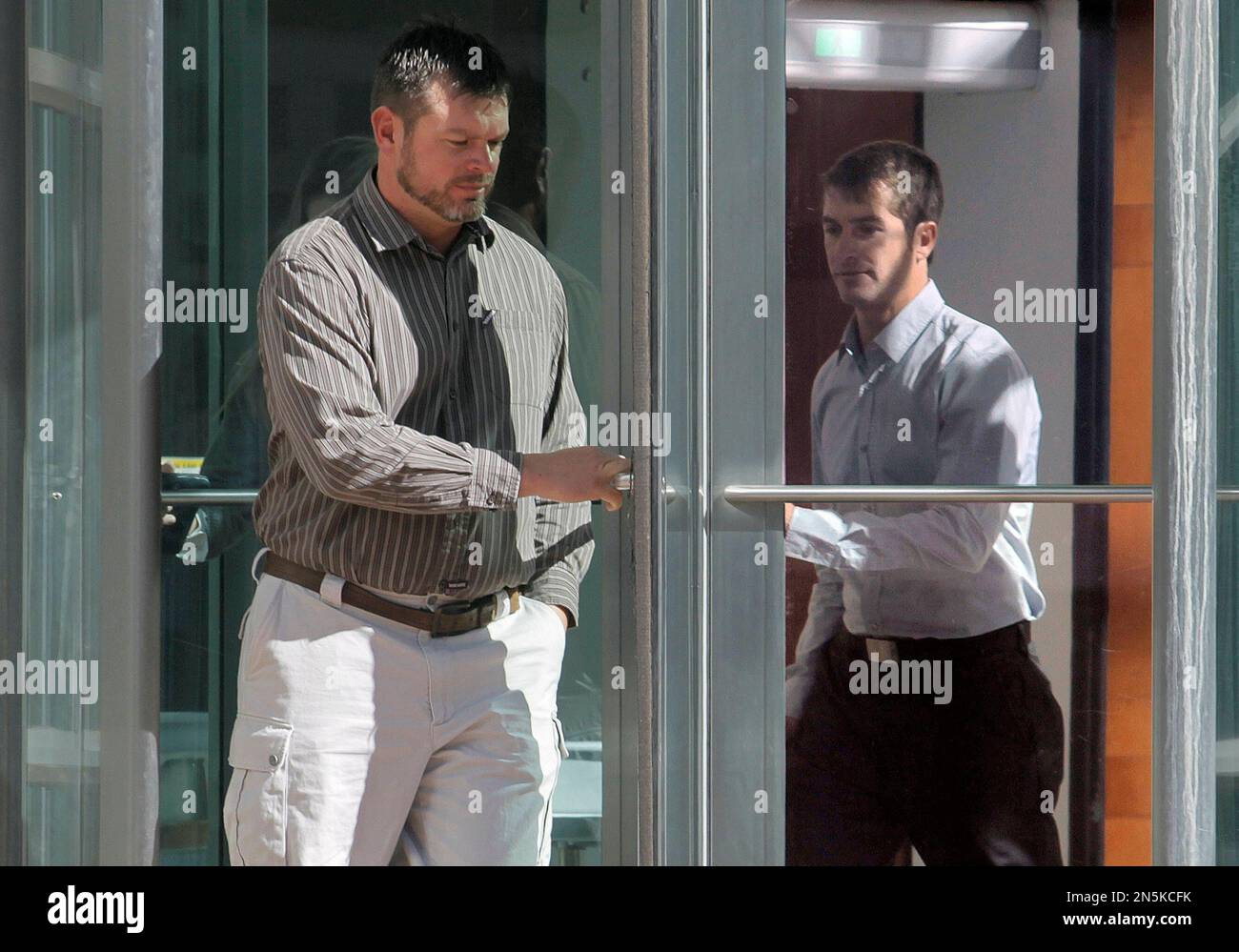 FILE - In this Oct. 22, 2013 file photo, Eric Jensen, 37, left, and ...