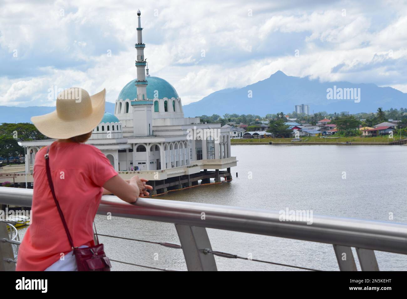 Kuching Floating mosque in city centre and lady admiring the view Stock ...
