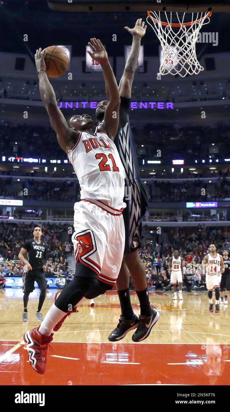 Minnesota Timberwolves center Ronny Turiaf, right, comes from behind ...