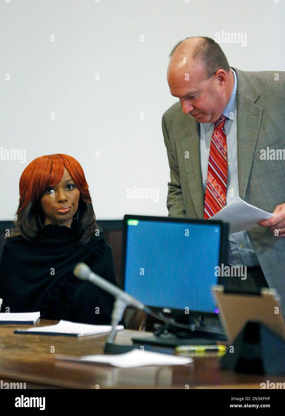 Natasha Stewart, also known as Pebbelz Da Model, confers with attorney ...