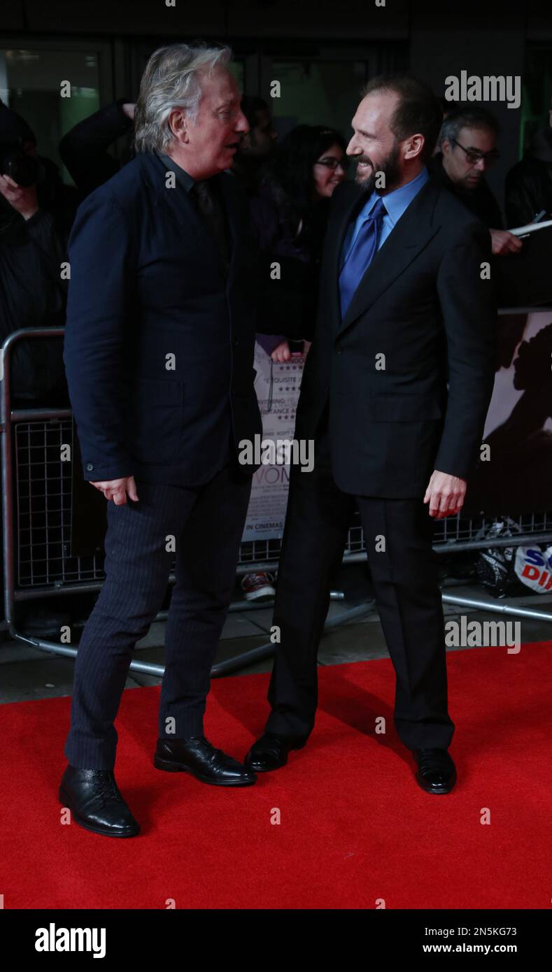 British actors Alan Rickman, left and Ralph Fiennes greet one another ...