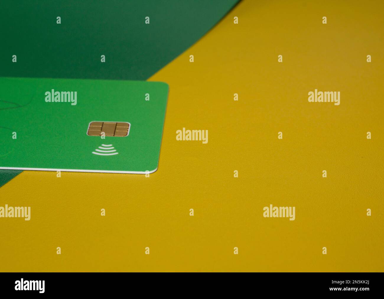 A blank card with a brown square chip symbol and an NFC. Concept of ...