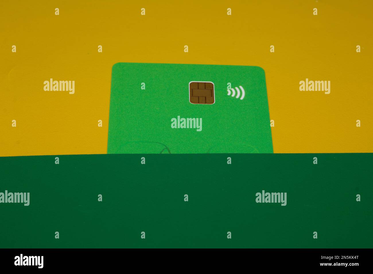 A blank card with a brown square chip symbol and an NFC. Concept of ...