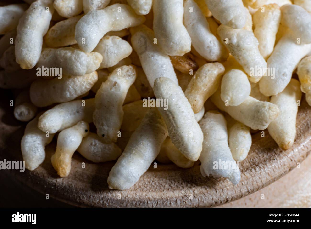Puffed rice in a wooden bowl Stock Photo - Alamy