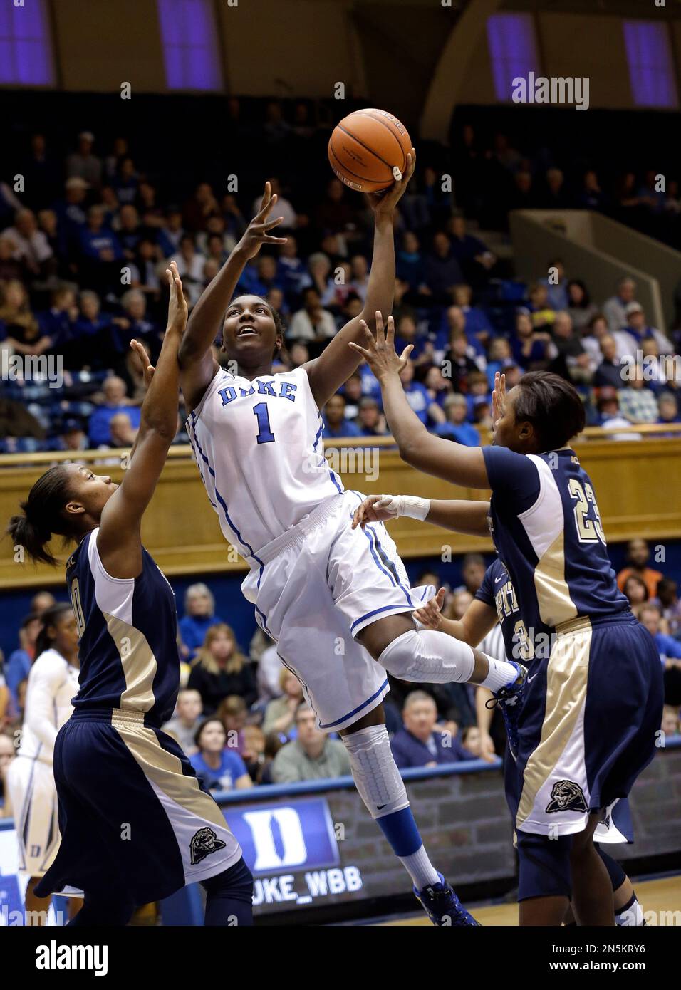 Duke's Elizabeth Williams (1) shoots between Pittsburgh's Asia Logan ...