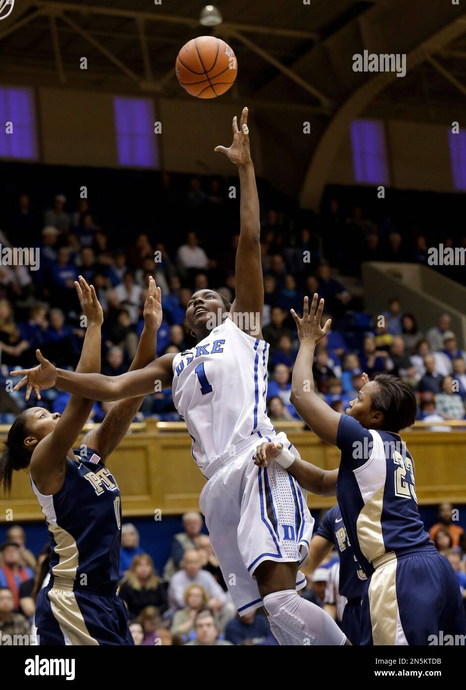 Duke's Elizabeth Williams (1) shoots between Pittsburgh's Asia Logan ...