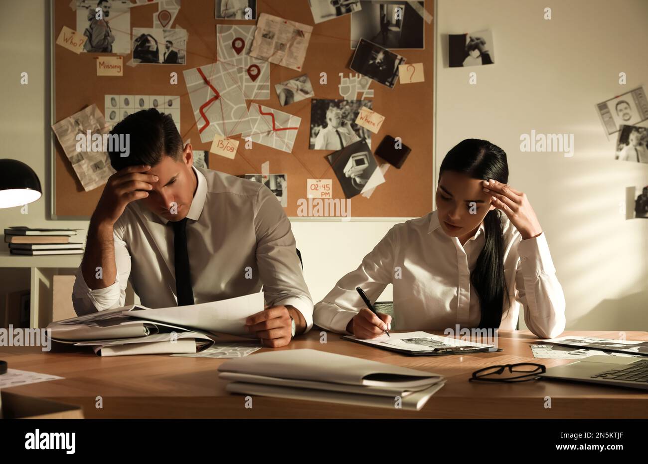 Professional detectives working desk hi-res stock photography and ...