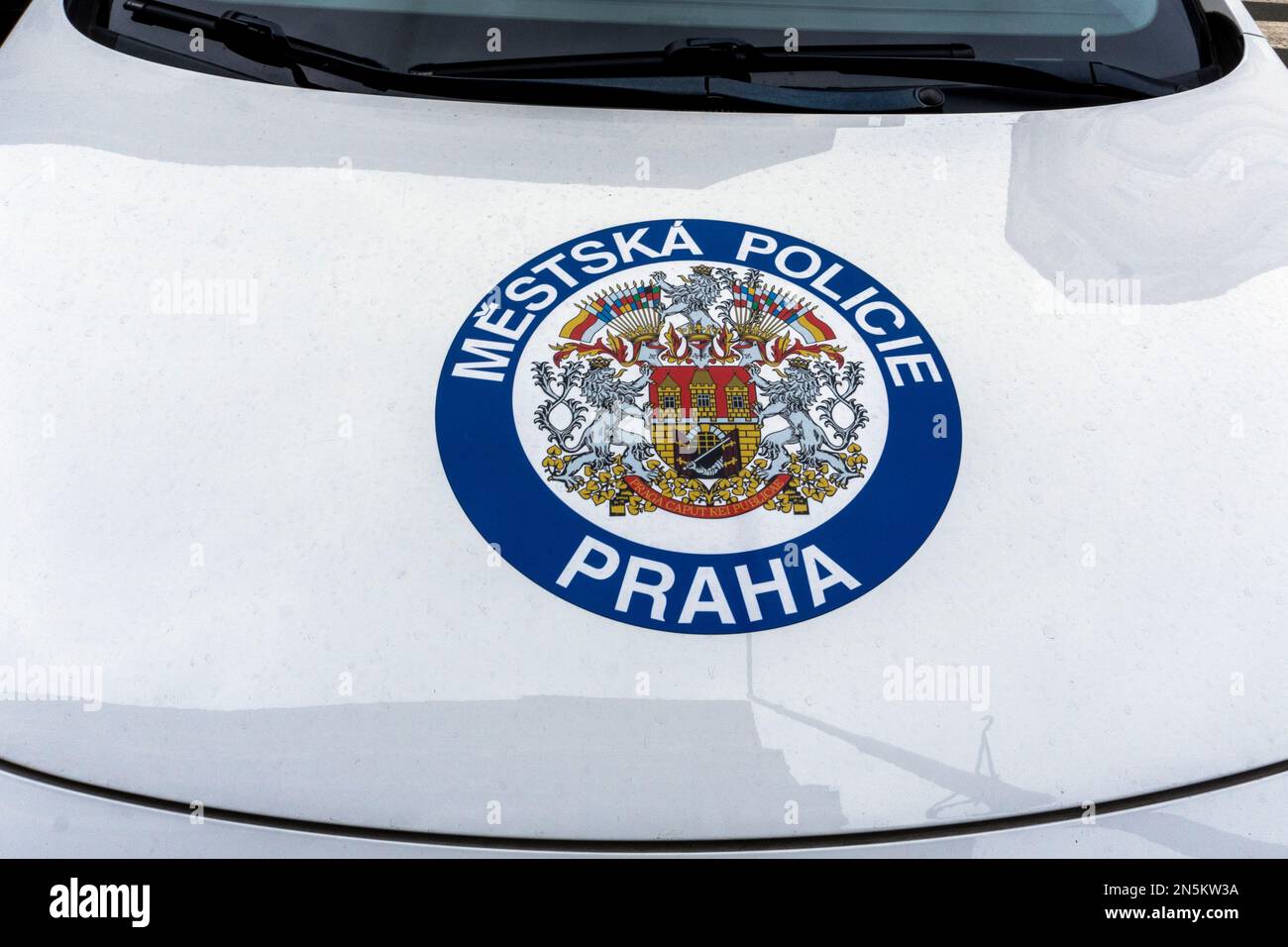 Logo of the local police in Prague, Czech Republic, on the bonnet of a ...