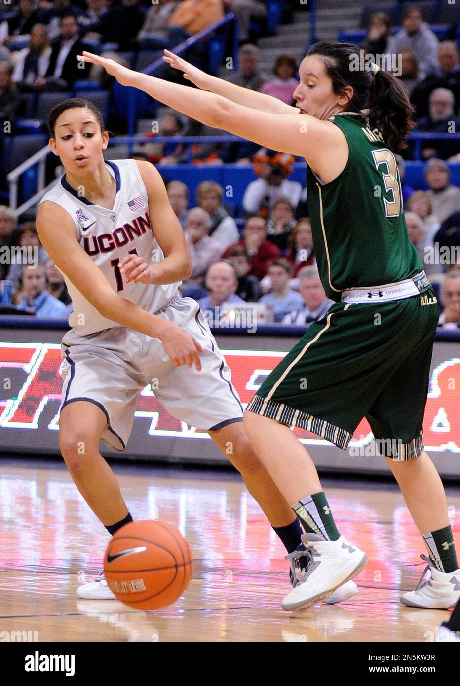 Connecticut's Bria Hartley, left, is guarded by South Florida's Laura ...