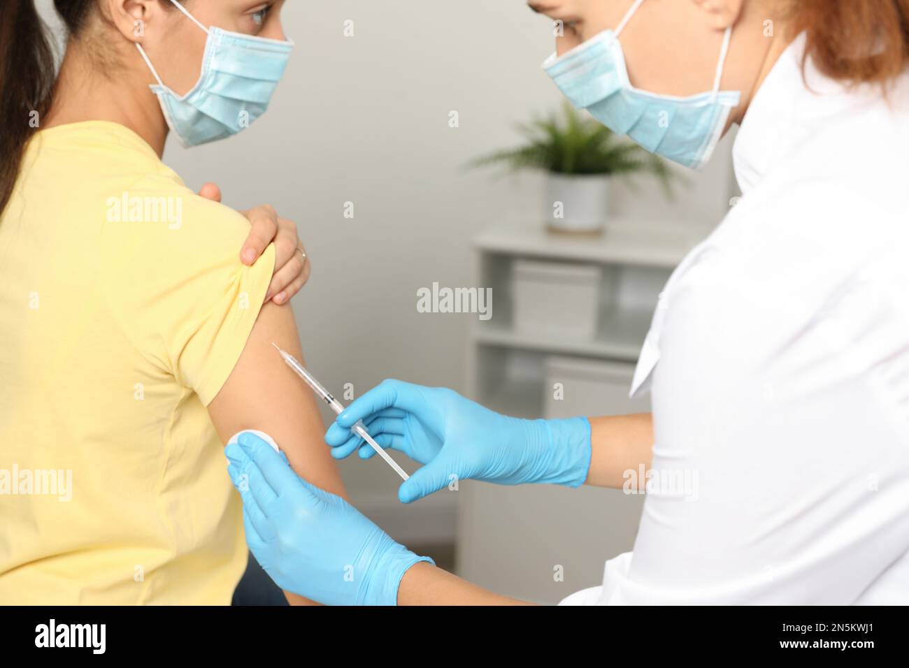 Doctor giving injection to patient in hospital, closeup. Vaccination ...