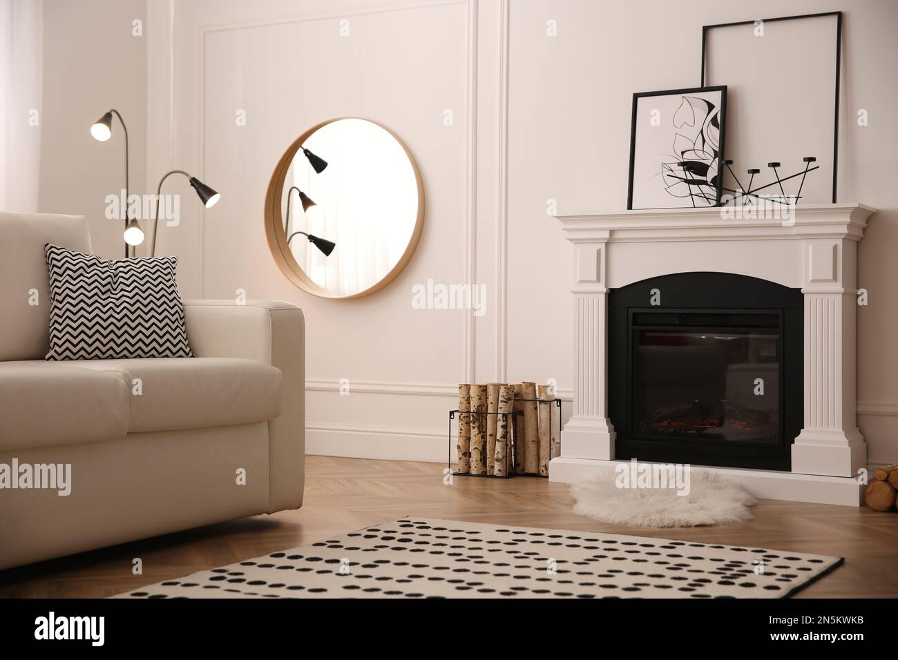 Modern fireplace with burning wood in room. Interior design Stock Photo ...