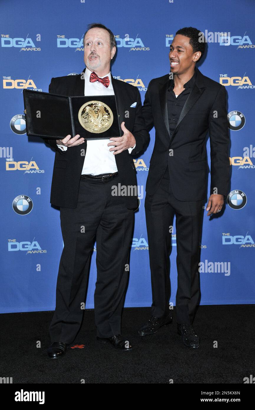 Neil P. DeGroot, left, and Nick Cannon pose in the press room of the ...