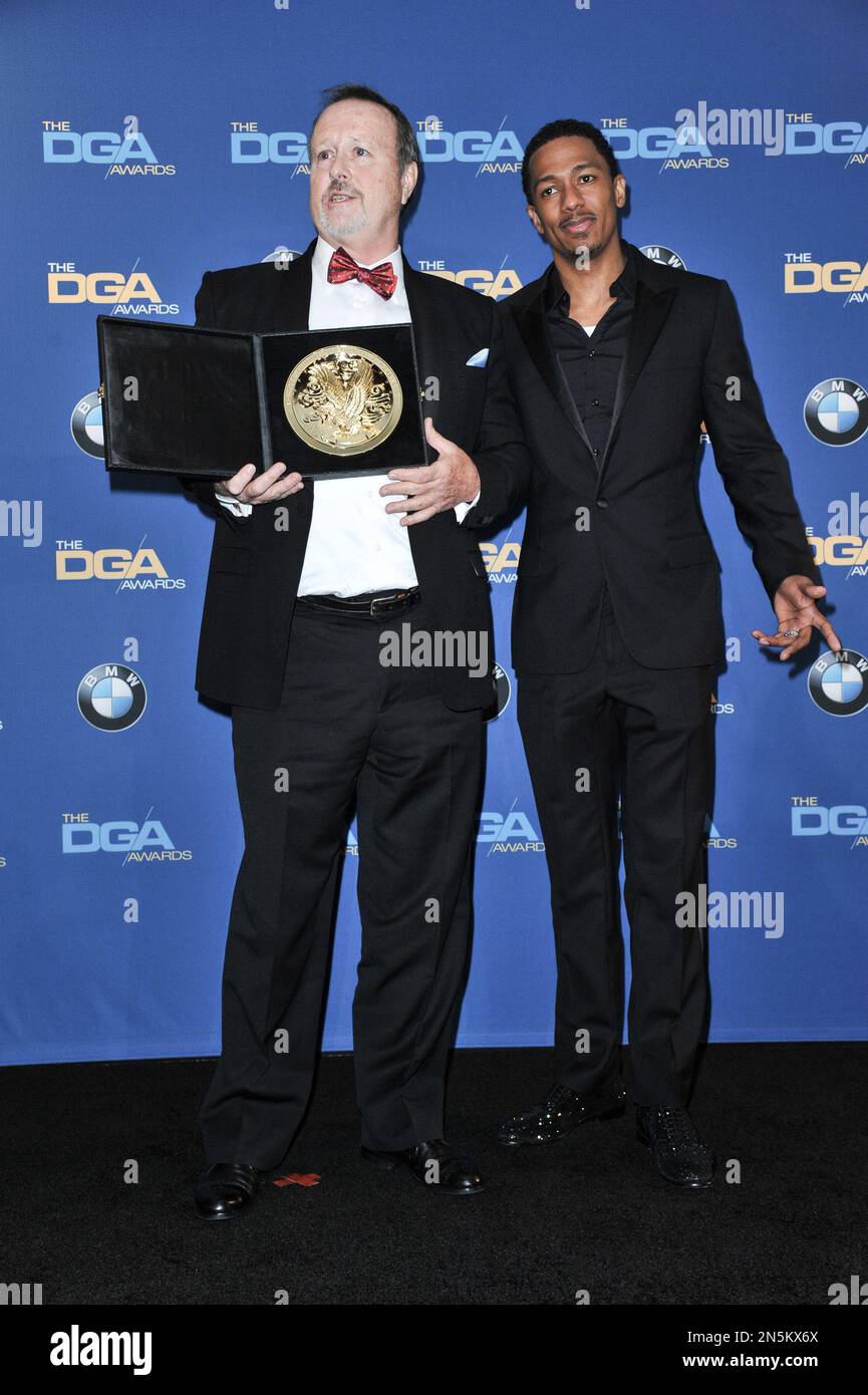 Neil P. DeGroot, left, and Nick Cannon pose in the press room of the ...
