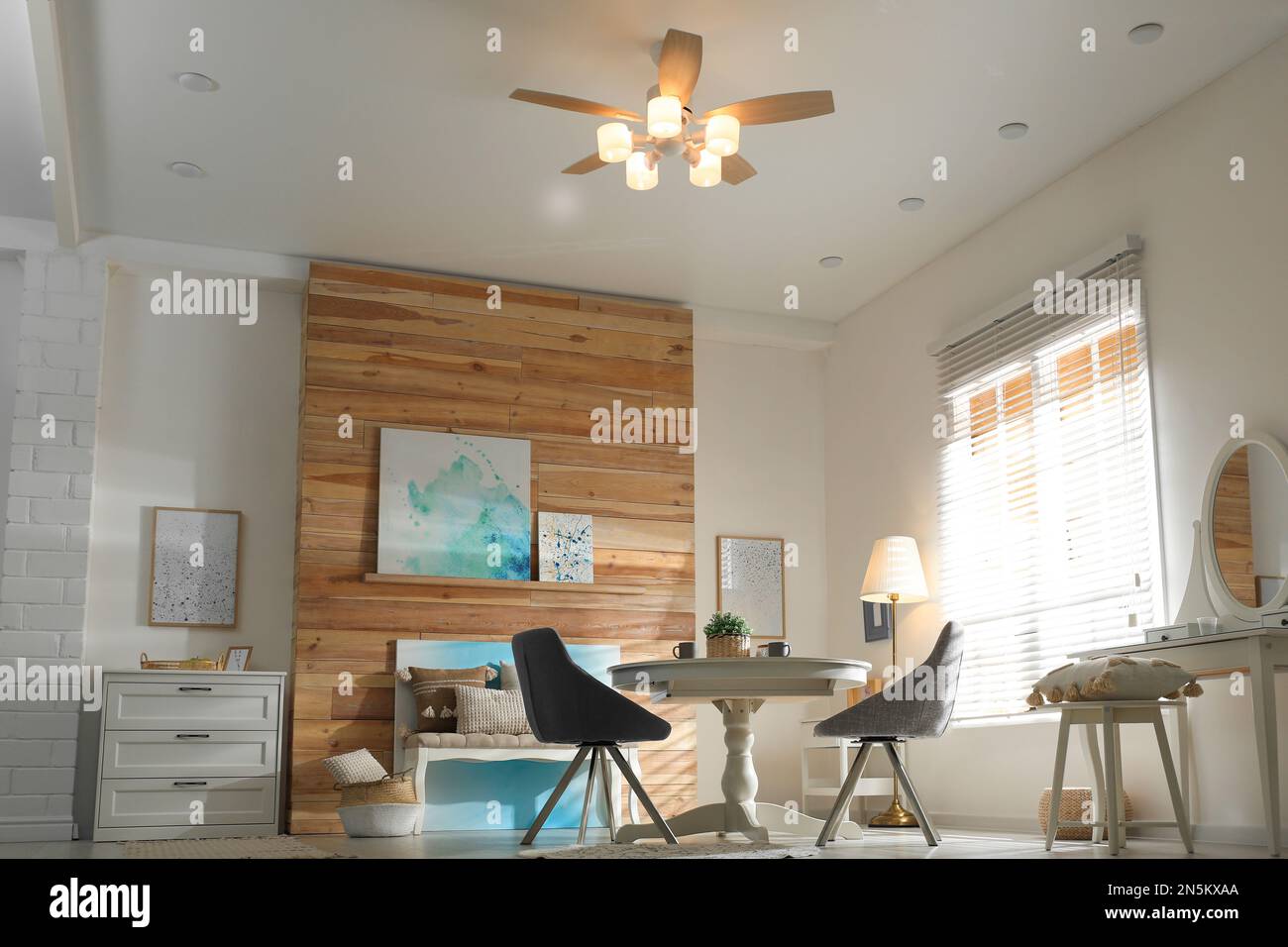 Stylish room interior with modern ceiling fan, low angle view Stock ...