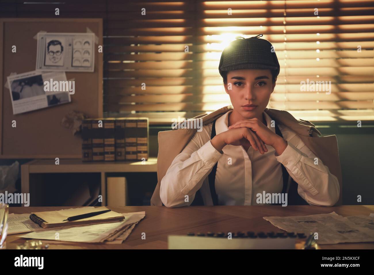 Old fashioned detective at table in office Stock Photo - Alamy