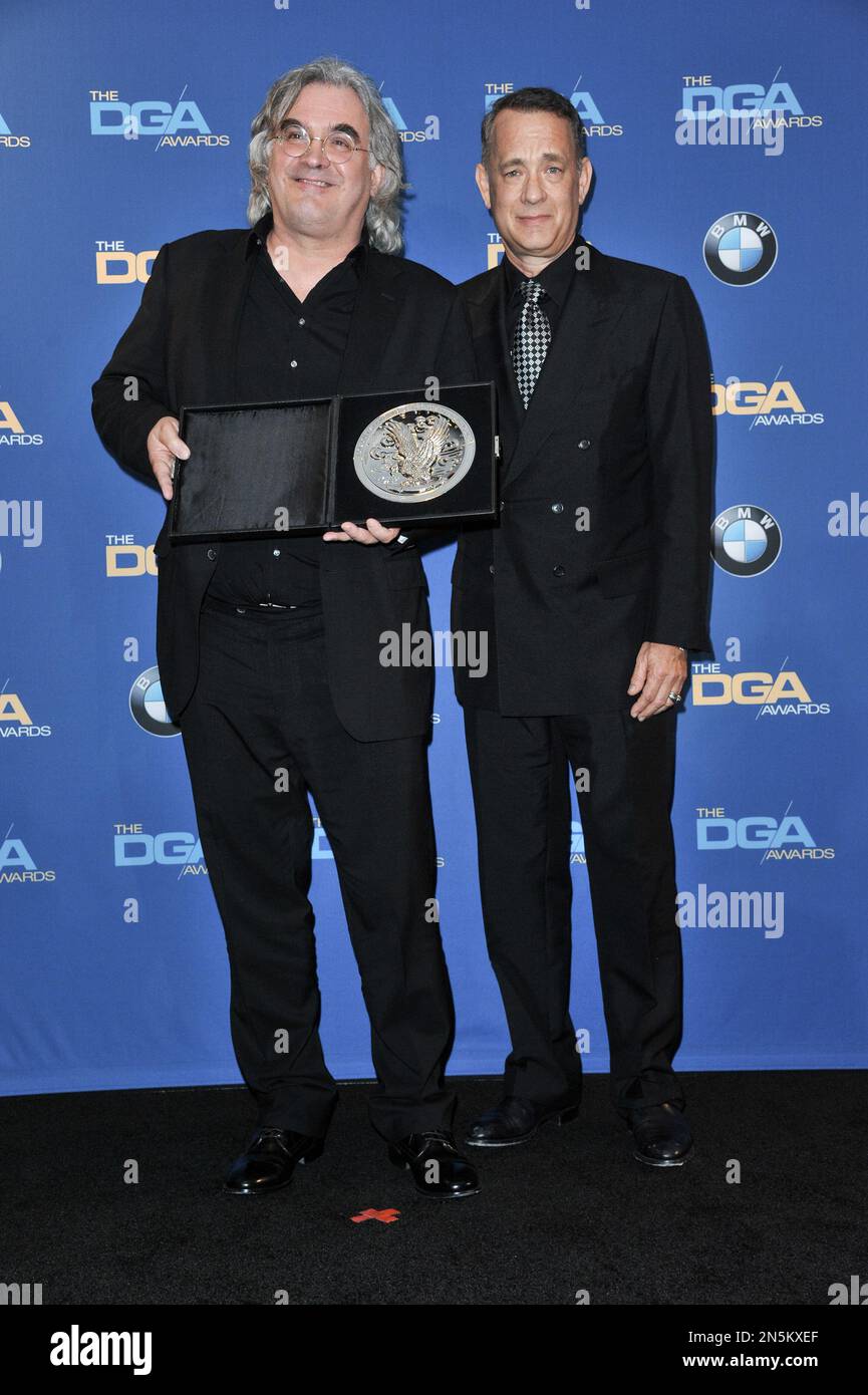 Paul Greengrass, left, and Tom Hanks pose in the press room of the the ...