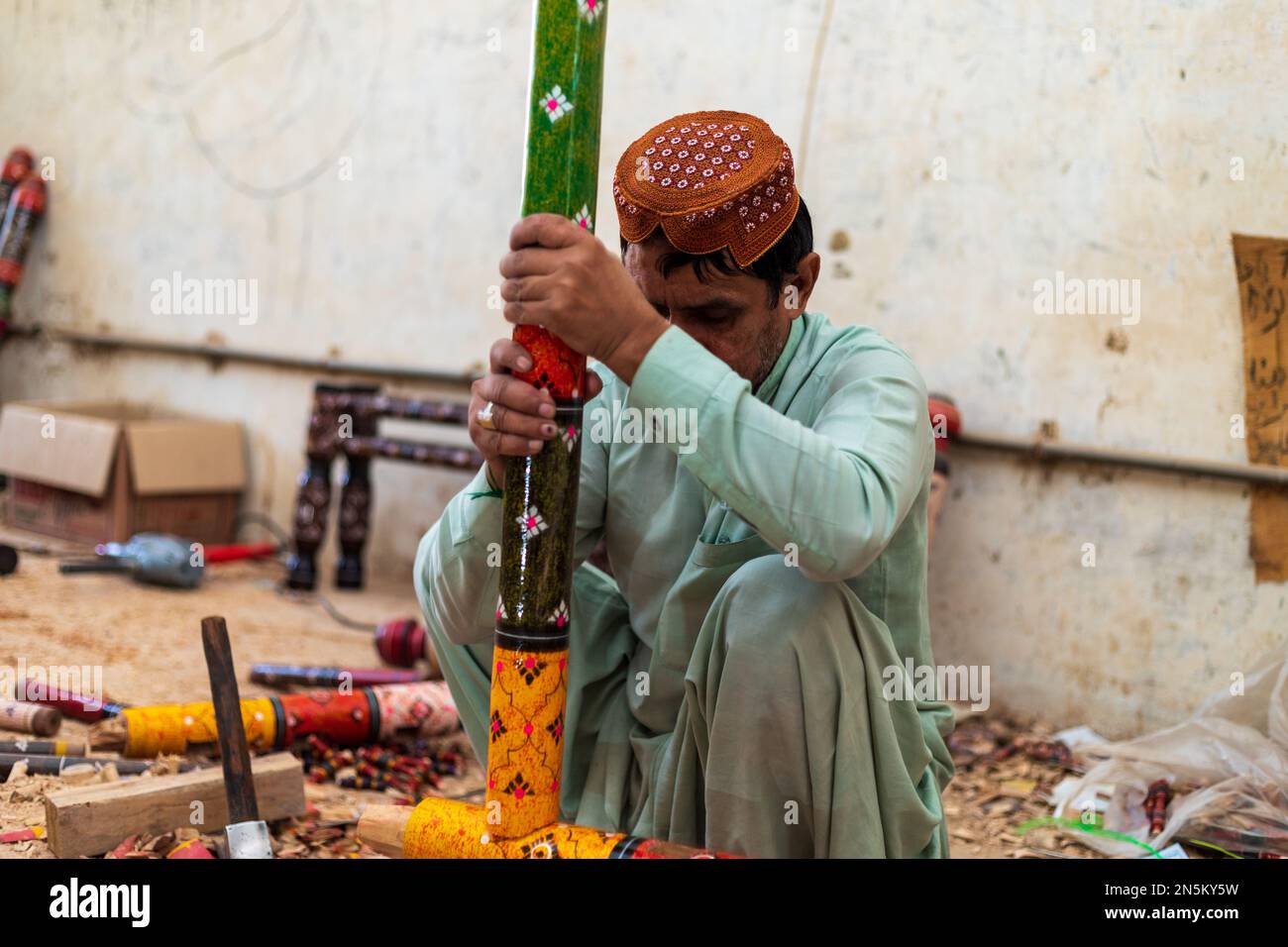 Hala Sindh 2022, Man wearing traditional sindhi cap, making Colorful ...