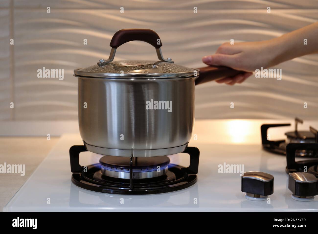 Woman burning stove hi-res stock photography and images - Alamy
