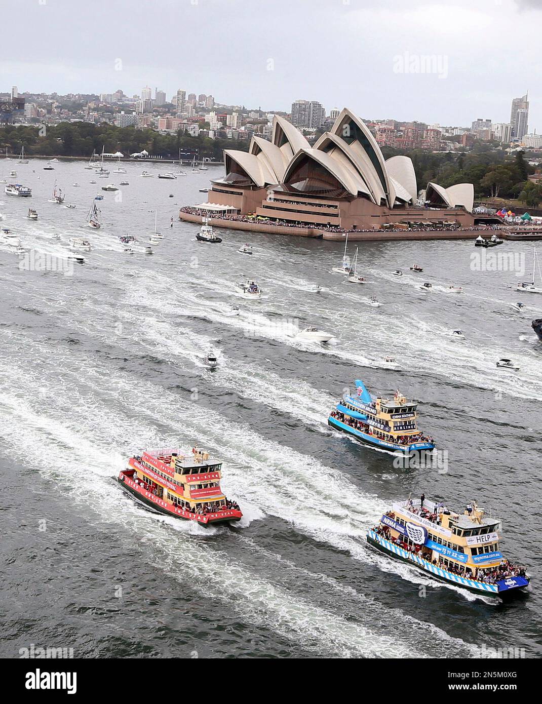 Ferries race past the opera house during the annual harbor ferry boat ...