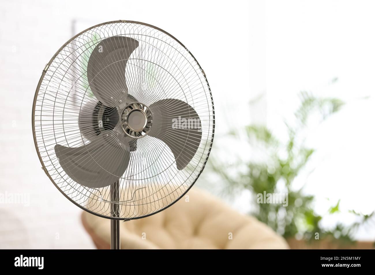 Modern electric fan in room. Space for text Stock Photo - Alamy