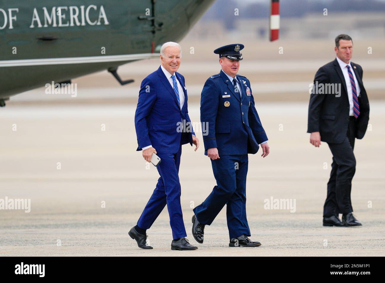 President Joe Biden walks with Col. Matthew E. Jones, 89th Airlift Wing ...