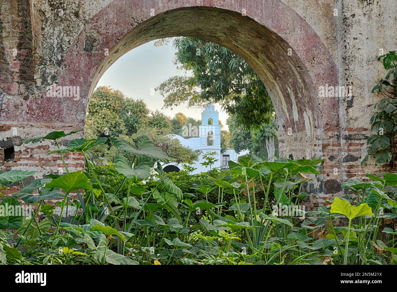 Arch with Church in Background Stock Photo - Alamy