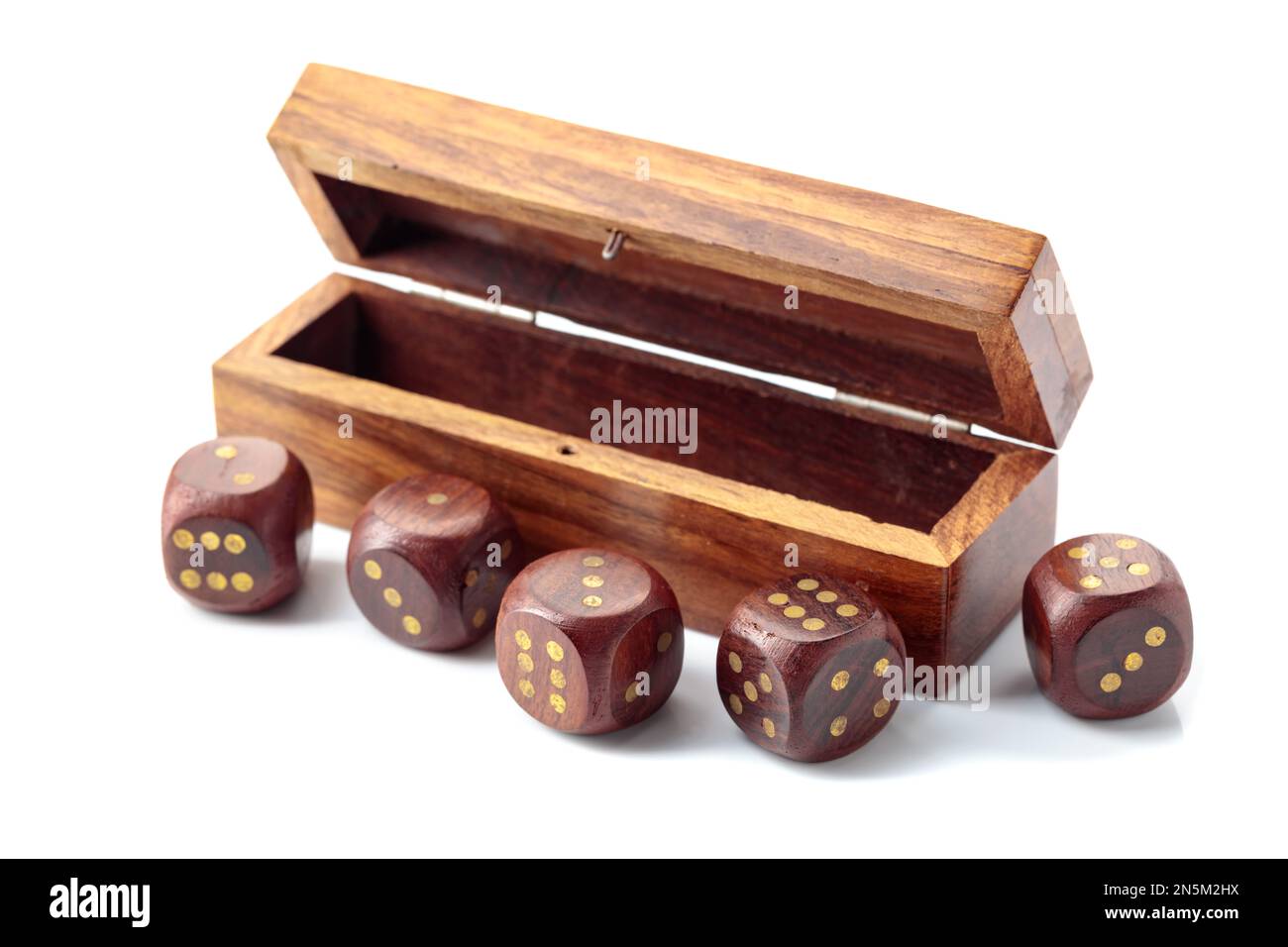 The old wooden dice with the box is isolated on a white background ...