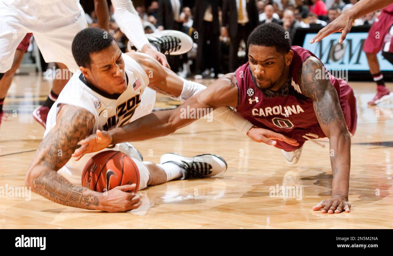 Missouri's Jabari Brown, left, and South Carolina's Sindarius Thornwell ...