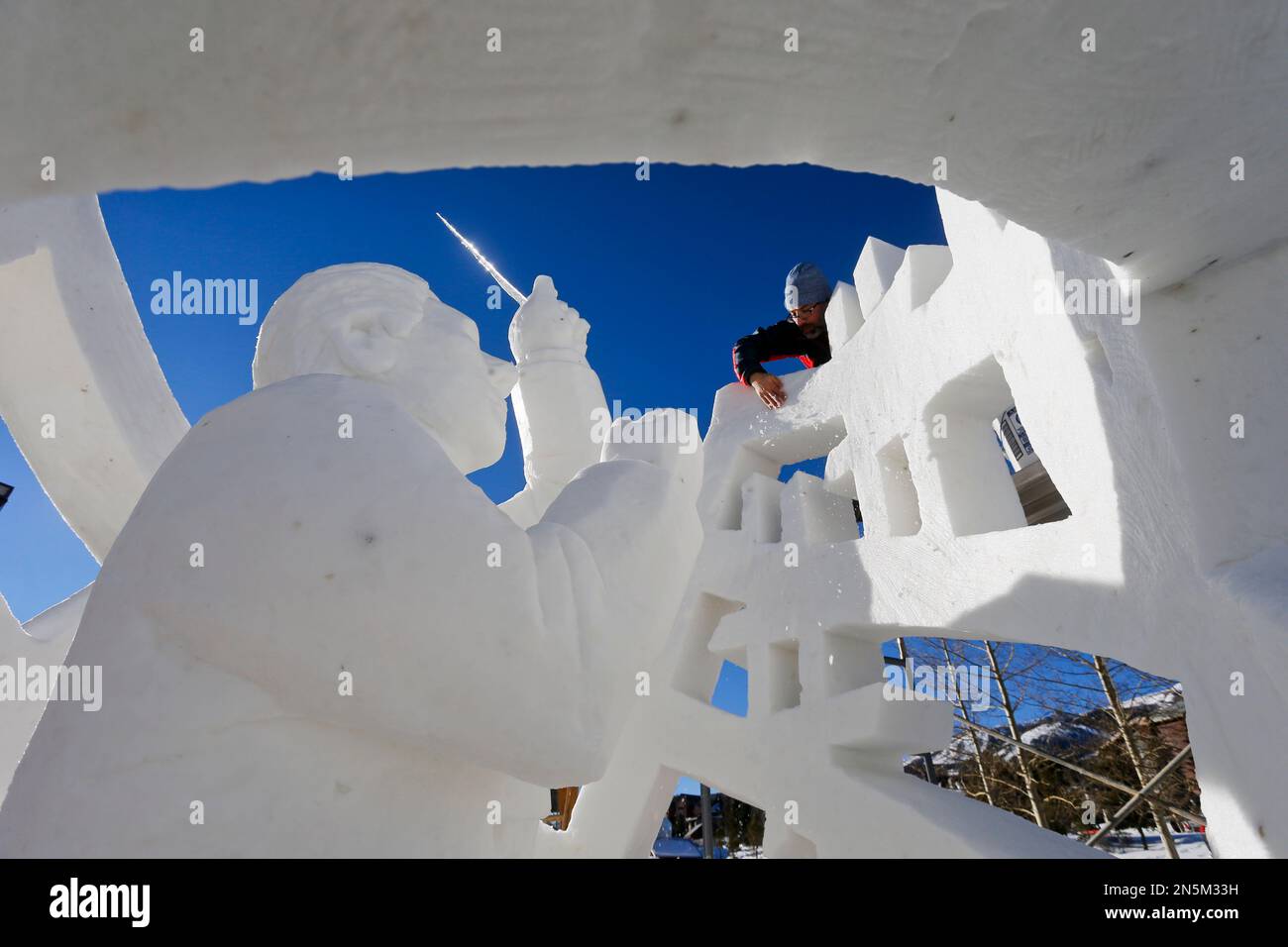 A teammate from Vermont, Brooke Monte puts some finishing touches on ...