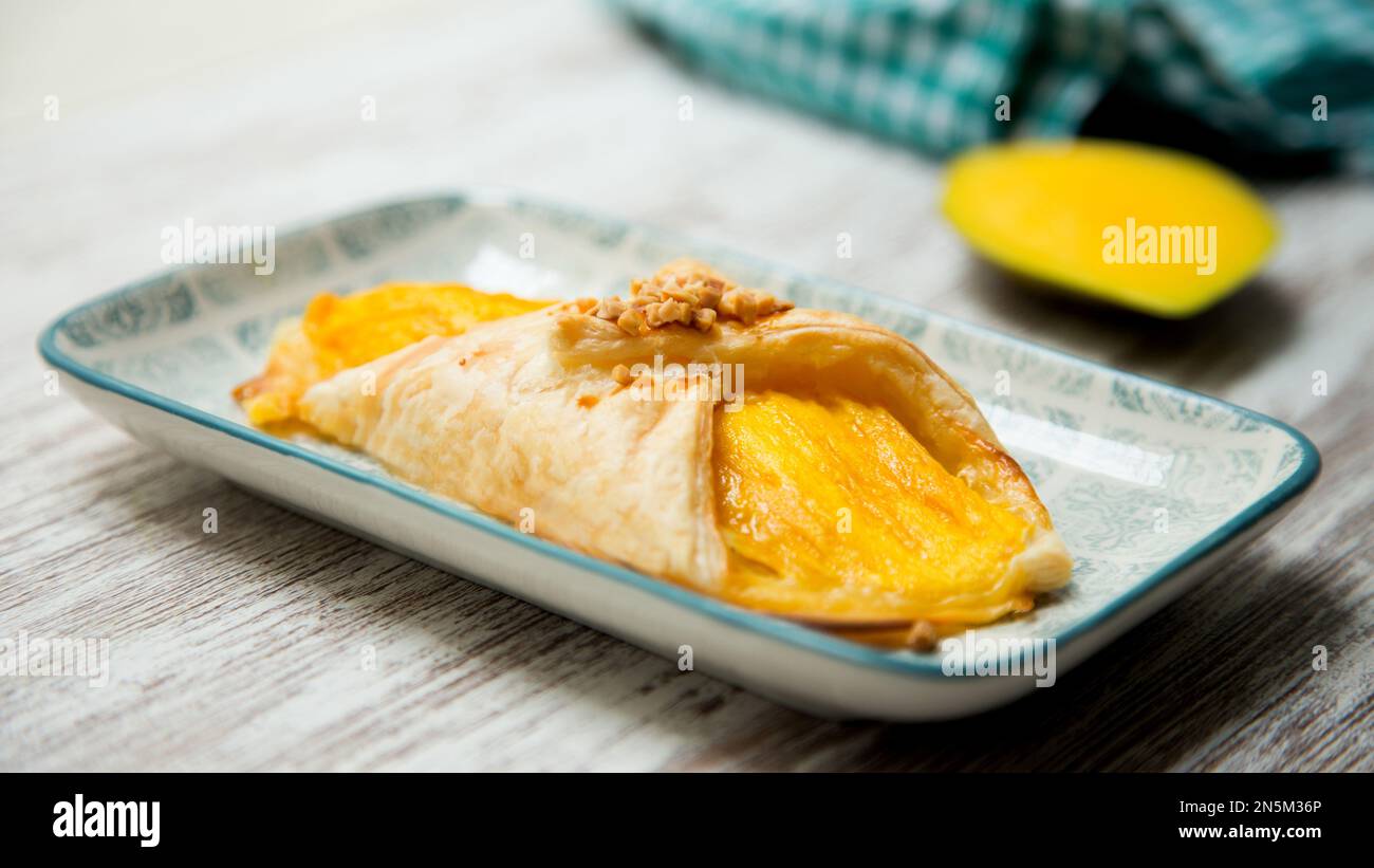 Delicious French dessert made with puff pastry filled with fresh mango ...