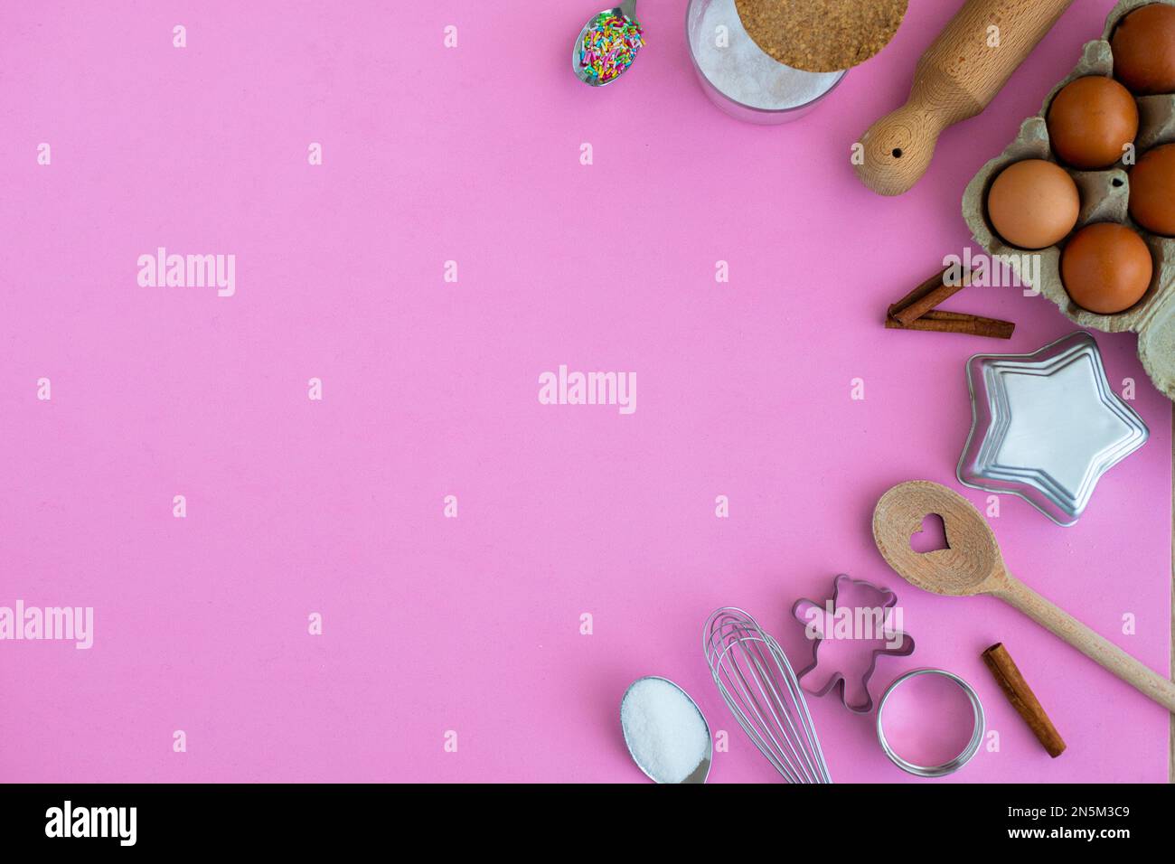 Baking tools and ingredients header, background with copy space. Pink ...