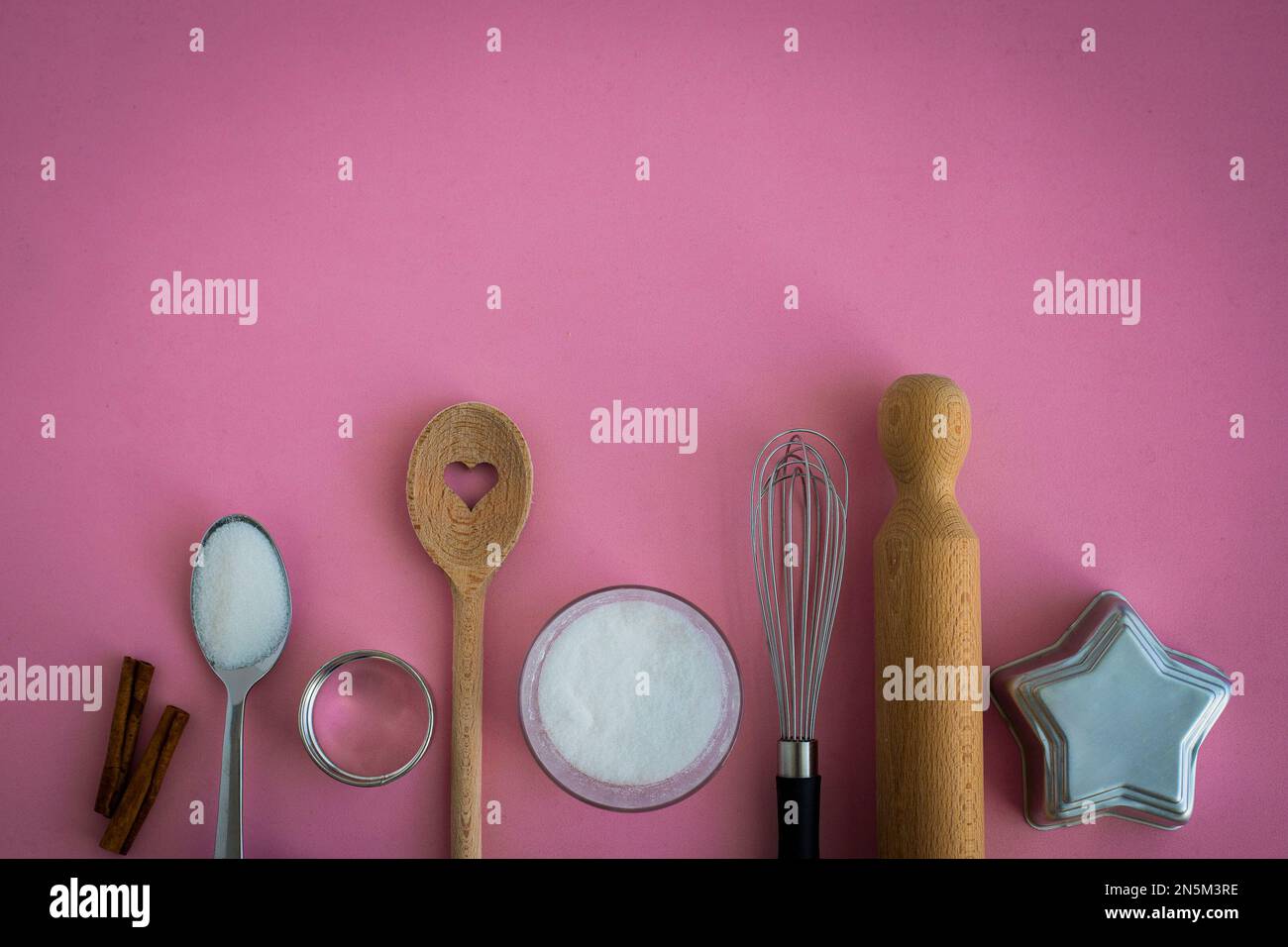 Baking tools and ingredients header, background with copy space. Pink ...