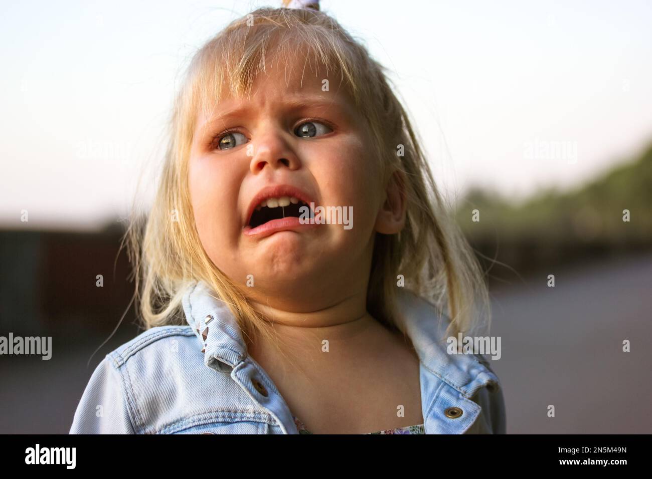 Unhappy child lost crying loudly with mouth open. Misery, grief of ...