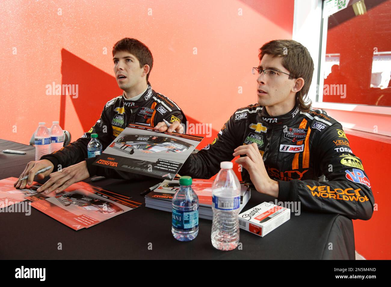 Drivers Ricky Taylor, left, and Jordan Taylor talk with fans during an ...